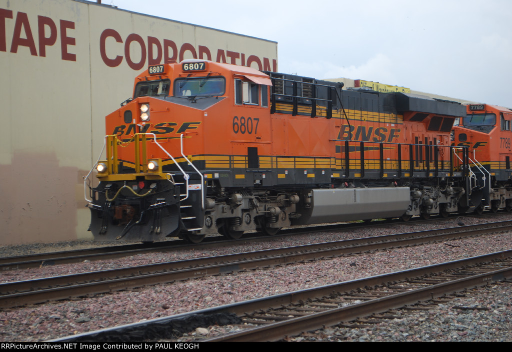 Close in of BNSF 6807 a New ES44C4 as she leads a Grain Train.